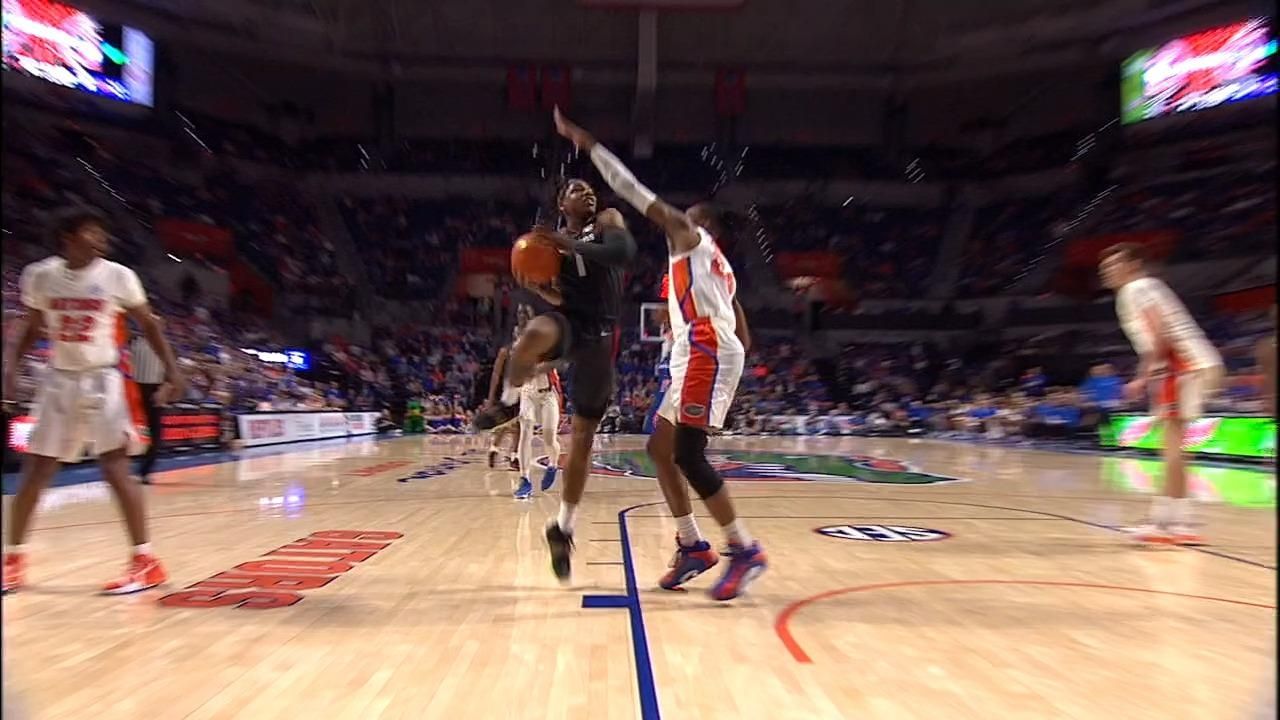 JD Notae muscles through his defender and drains the shot for Arkansas ...