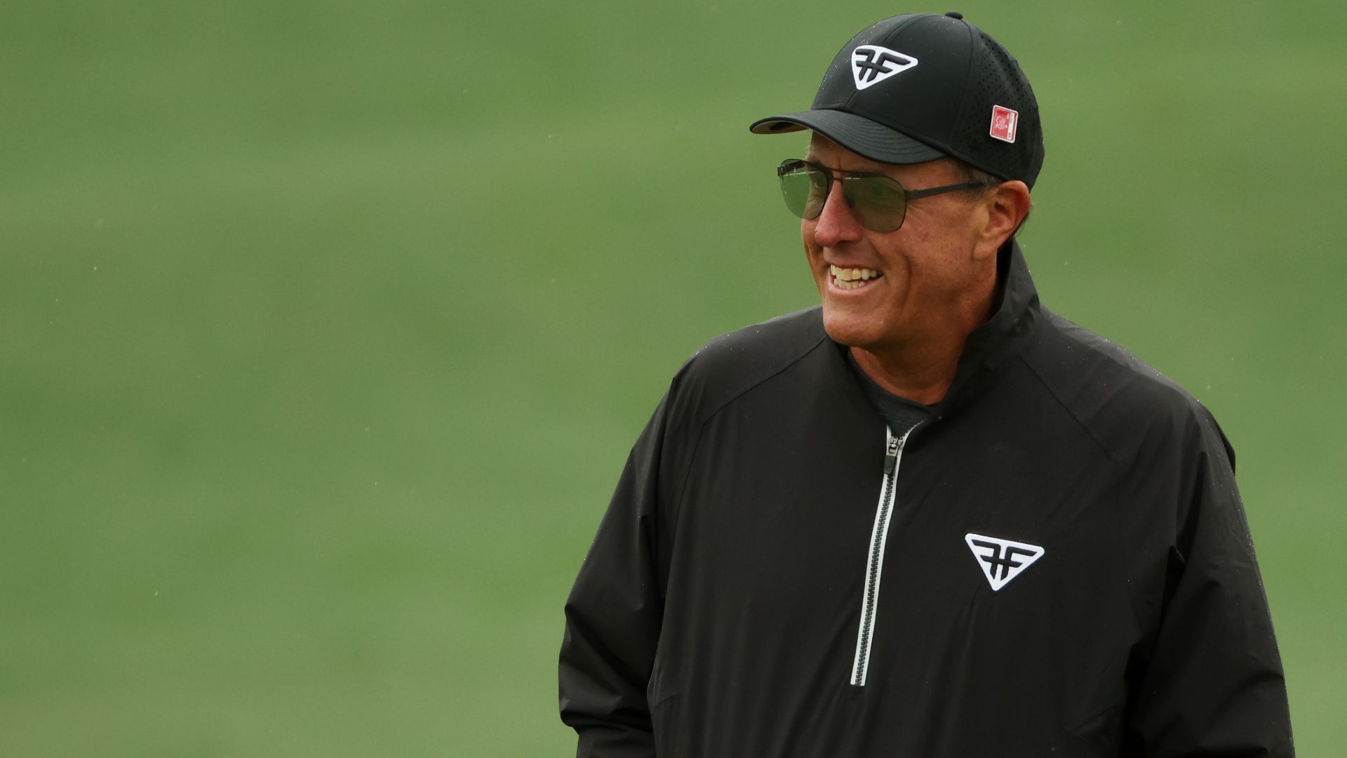 Phil Mickelson raises a fist as he knocks down long birdie putt on 6 ...