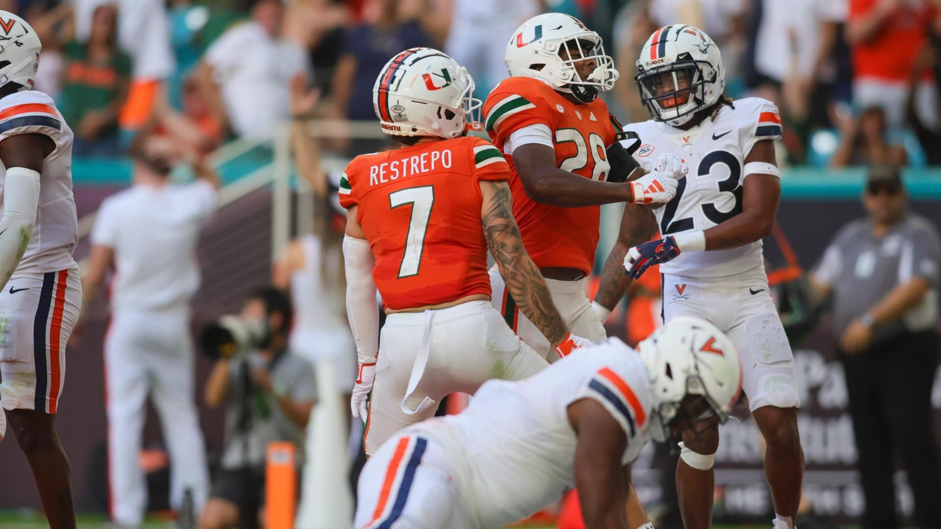 Ajay Allen leaps a defender en route to a Miami TD - ESPN Video
