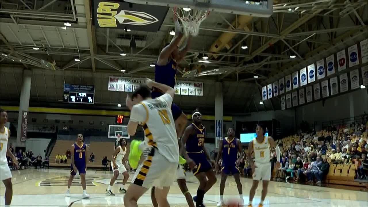 Western Illinois' Jesiah West elevates for a baseline putback jam ...