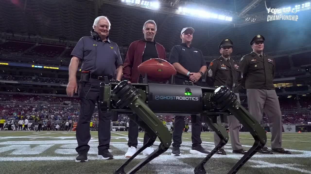 Robotic Dog presents game ball to Kurt Warner in UFL championship ...