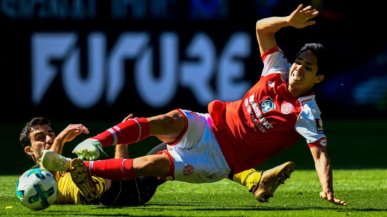 Ex Real Madrid and Barcelona winger Figo enjoys swim with pigs in ...