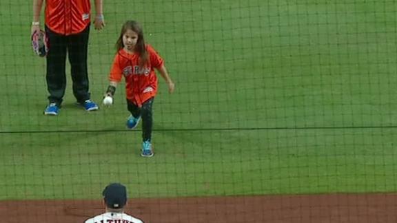 Game 4 first pitch tossed by young girl with prosthetic hand - ABC7 Los ...