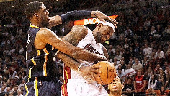 Caption this: LeBron James gets fouled by the Pacers' Roy Hibbert ...