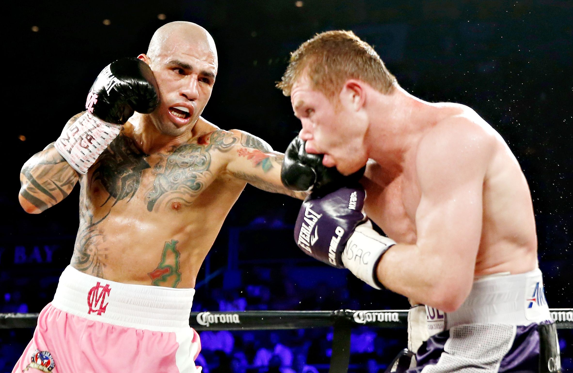 Battling back - Photos: Miguel Cotto vs. Canelo Alvarez - ESPN