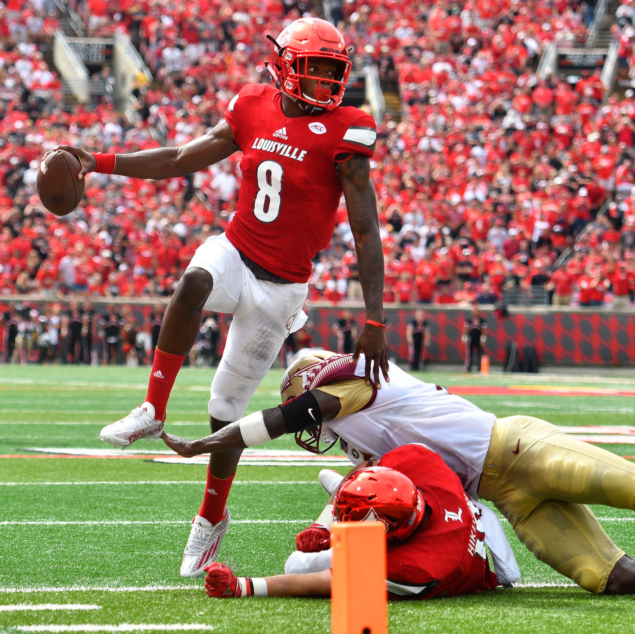 Lamar Jackson dazzles on big stage - Photos: Best of College Football ...